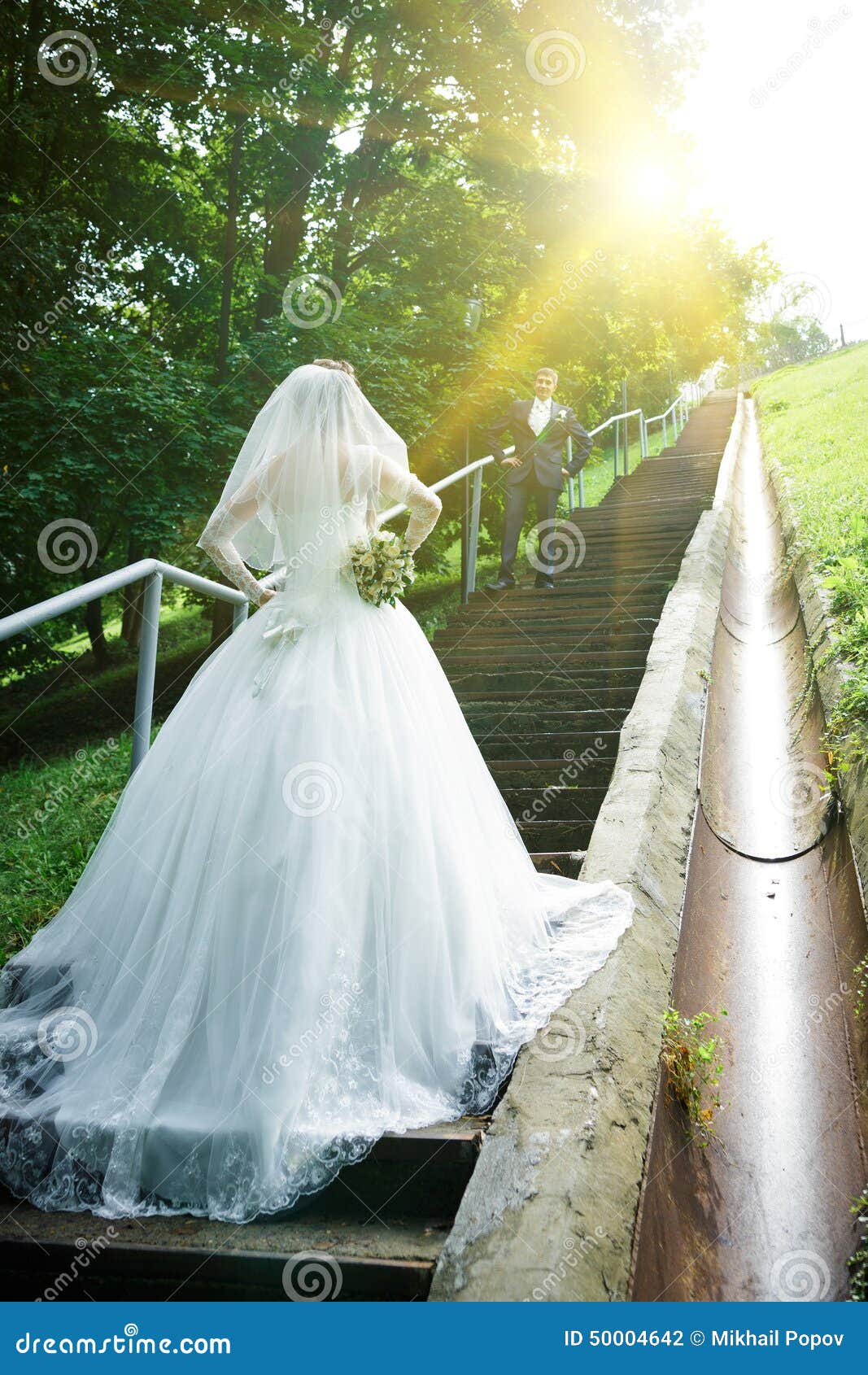 Bride Standing on a Staircase Stock Photo - Image of staircase ...