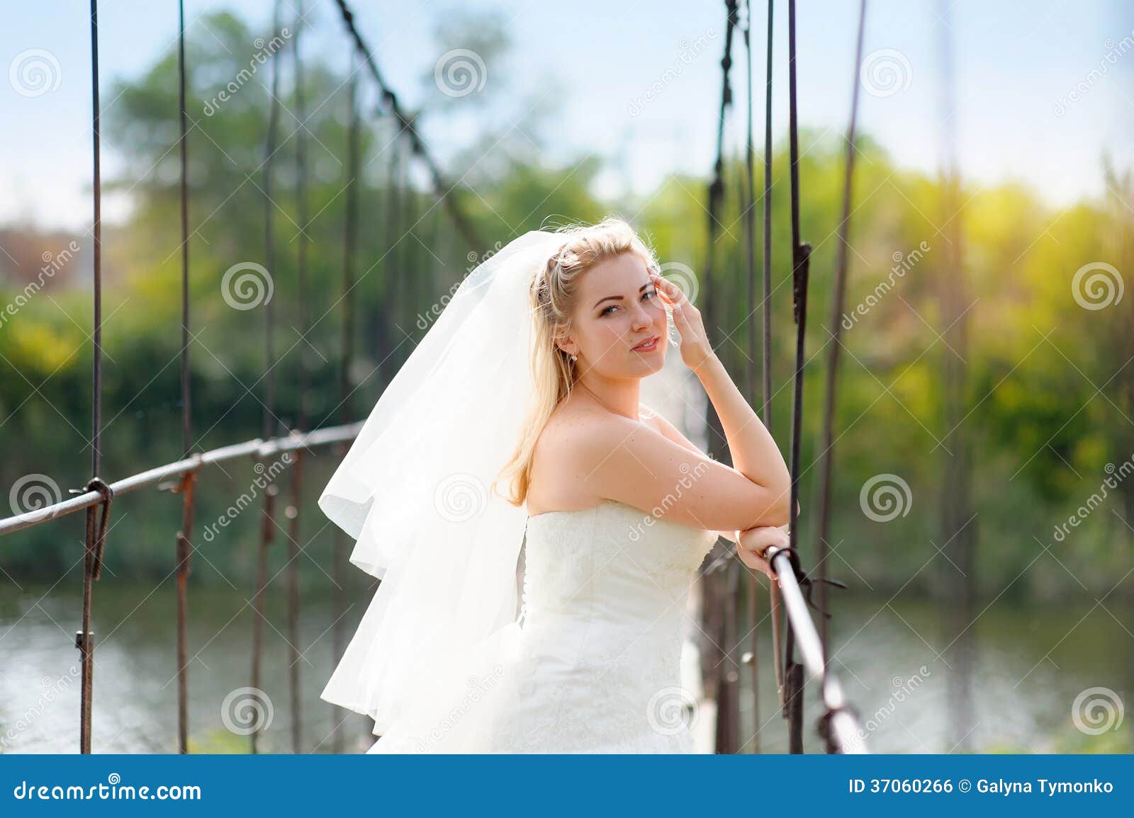 Bride stands on the bridge stock photo. Image of ceremony - 37060266