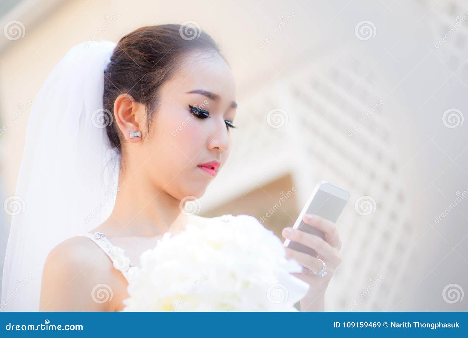 Bride Talking on Cell Phone in Wedding Dress Stock Image - Image of ...