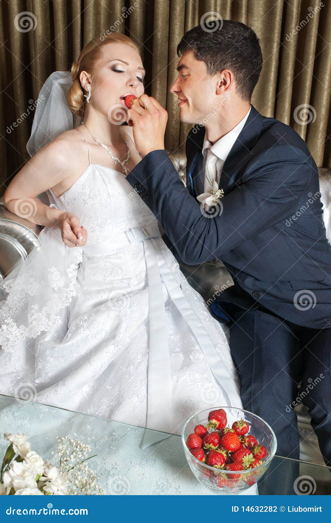 Bride Tasting Strawberry from Groom Stock Photo - Image of folds ...