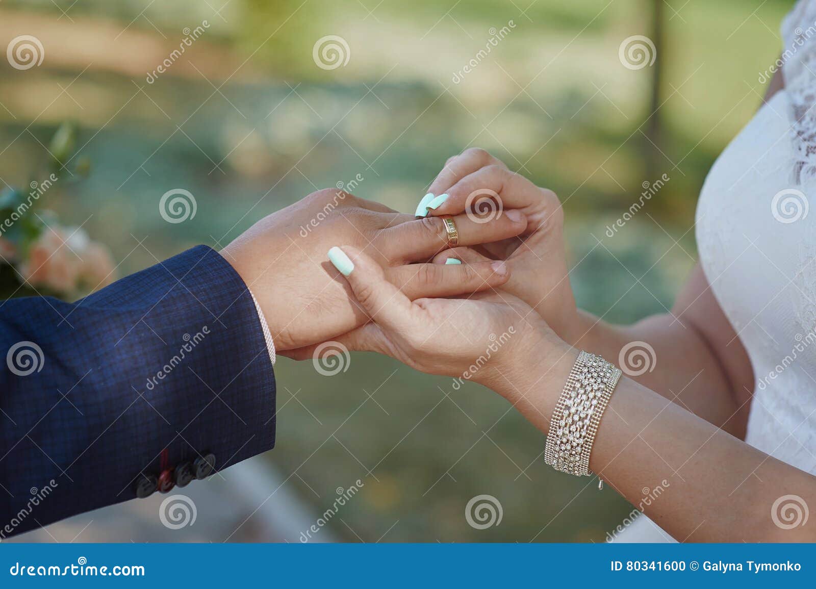 Bride Wears a Wedding Ring on the Finger of Groom Stock Photo - Image ...