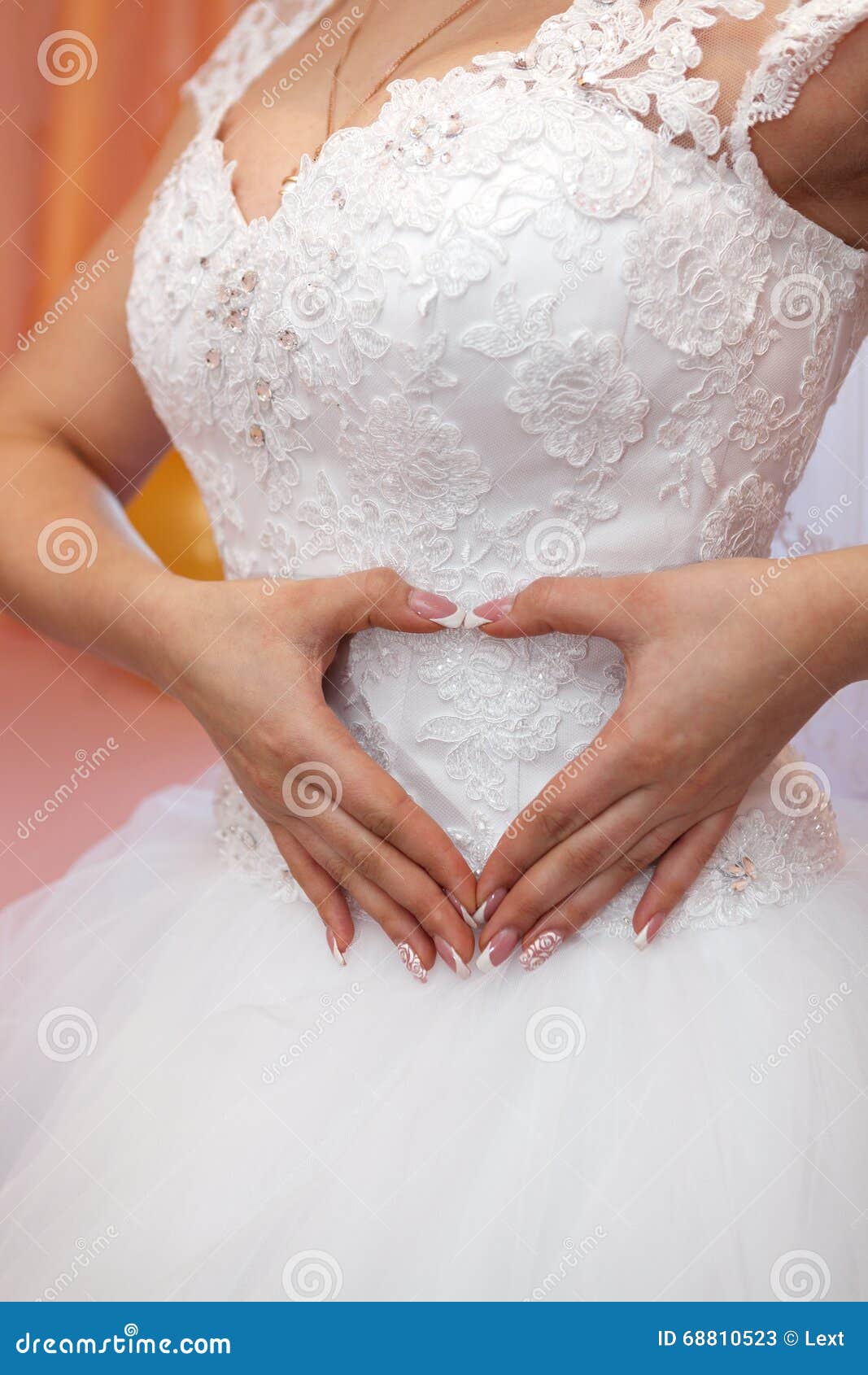 The Bride in White Dress Holding Hands in a Heart Shape. Stock Image ...