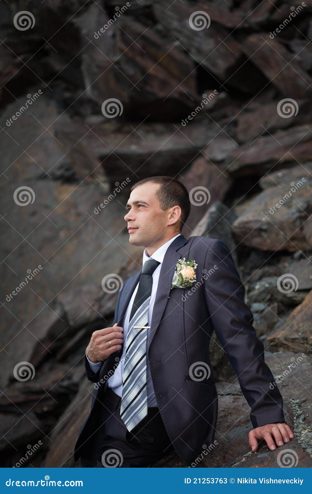 Bridegroom Looks Away To the Background of Rocks Stock Image - Image of ...