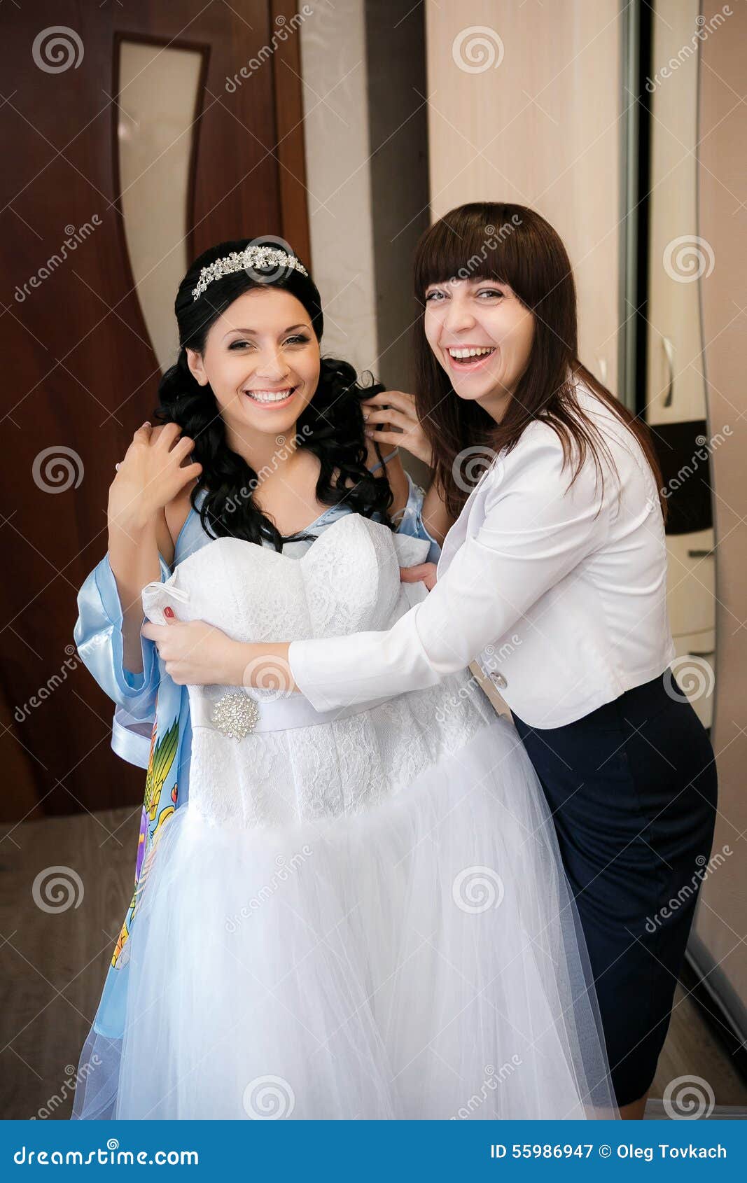 Bridesmaid Helps the Bride To Be Prepared for a Wedding Ceremony Stock ...