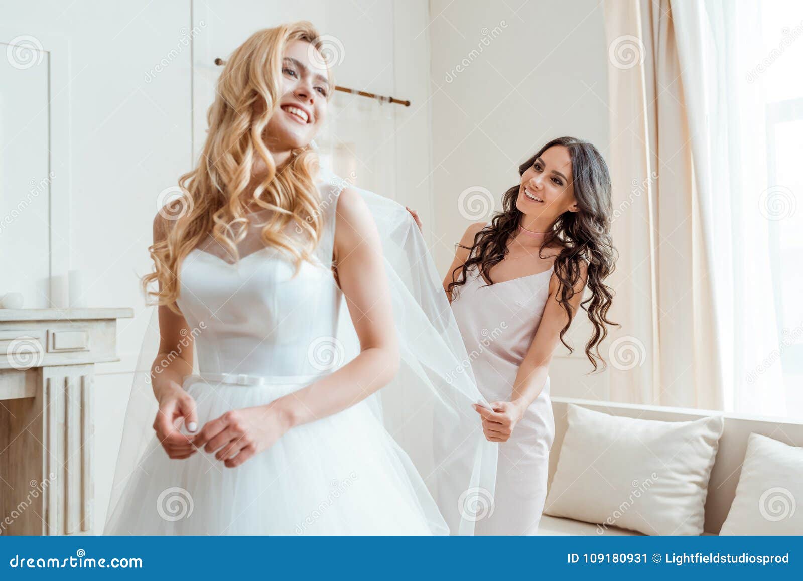 Bridesmaid Preparing Bride for Ceremony Stock Image - Image of wedding ...