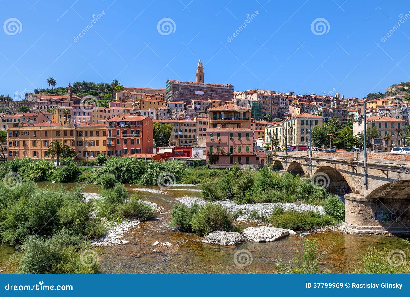 Bridge Across Overgrown Riverbed and View on Small Town. Stock Image ...