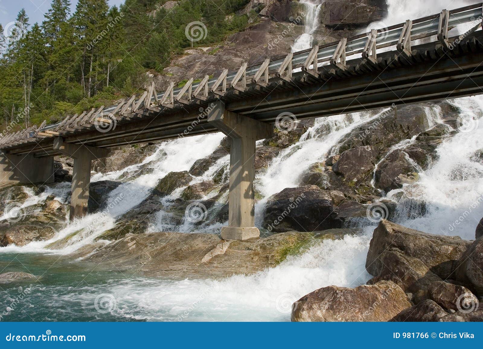 Bridge across a waterfall stock photo. Image of glacier - 981766