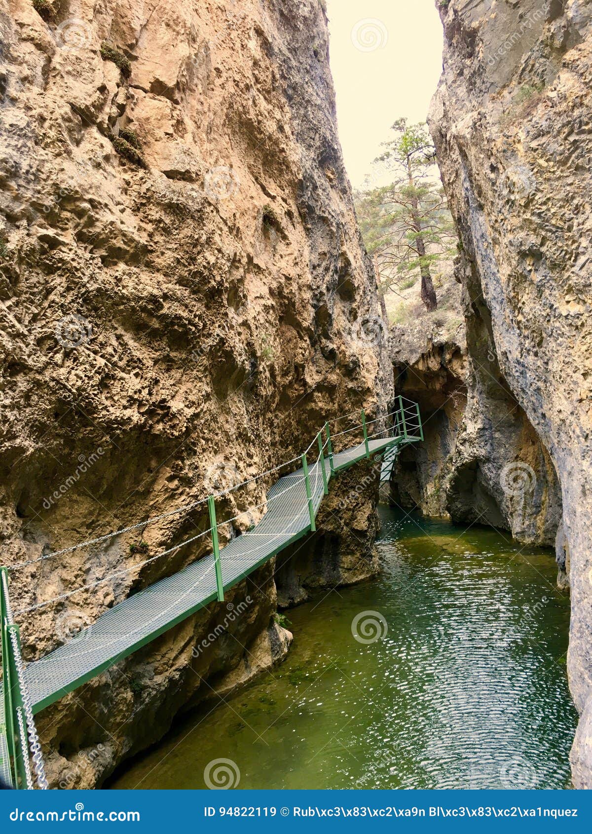 Bridge attached to rock stock image. Image of river, green - 94822119