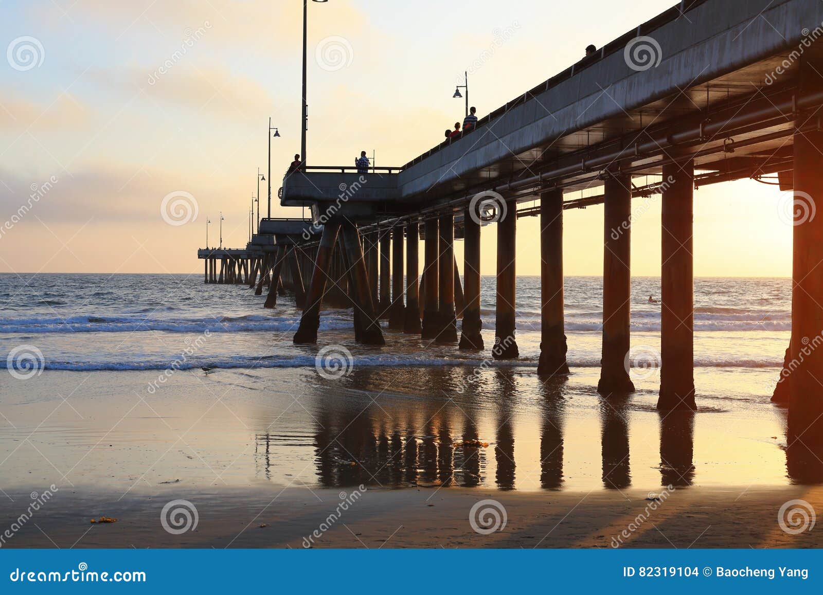 Bridge in the beach stock photo. Image of sunset, clouds - 82319104