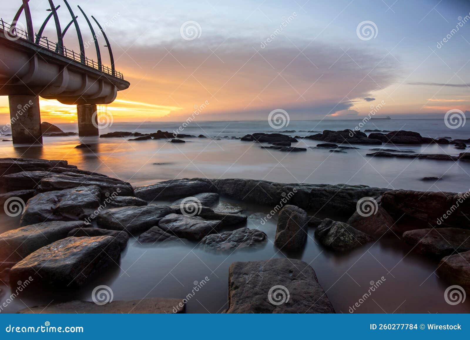 Bridge on the Beach at Sunset, Long Exposure Stock Photo - Image of ...