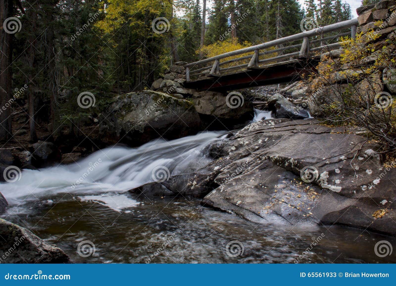 Bridge and Cascade stock image. Image of fall, slow, rockies - 65561933