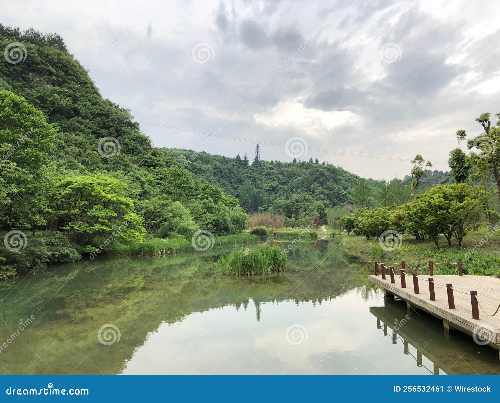 Bridge on the Clear Lake with the Reflection of the Trees Stock Image ...
