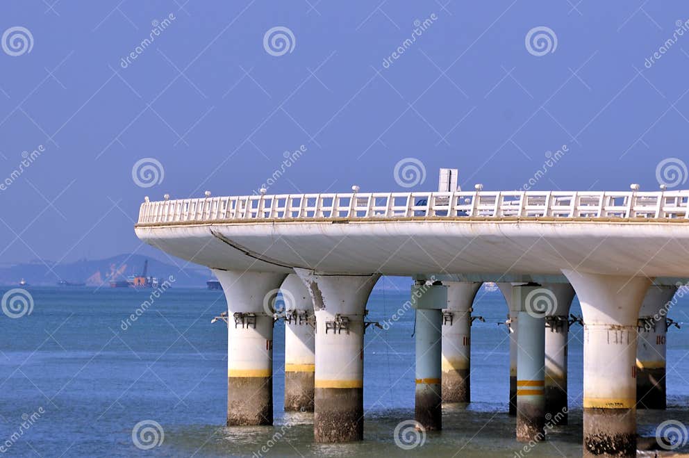 Bridge curve at sea coast stock image. Image of pile - 27960381