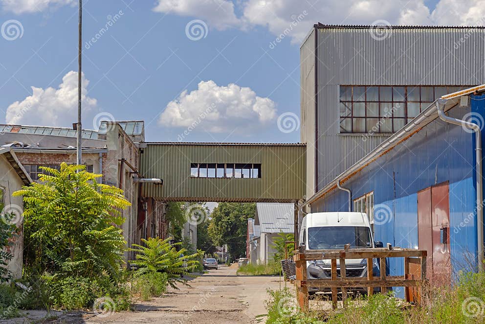 Bridge between Factory Buildings Stock Image - Image of buildings ...