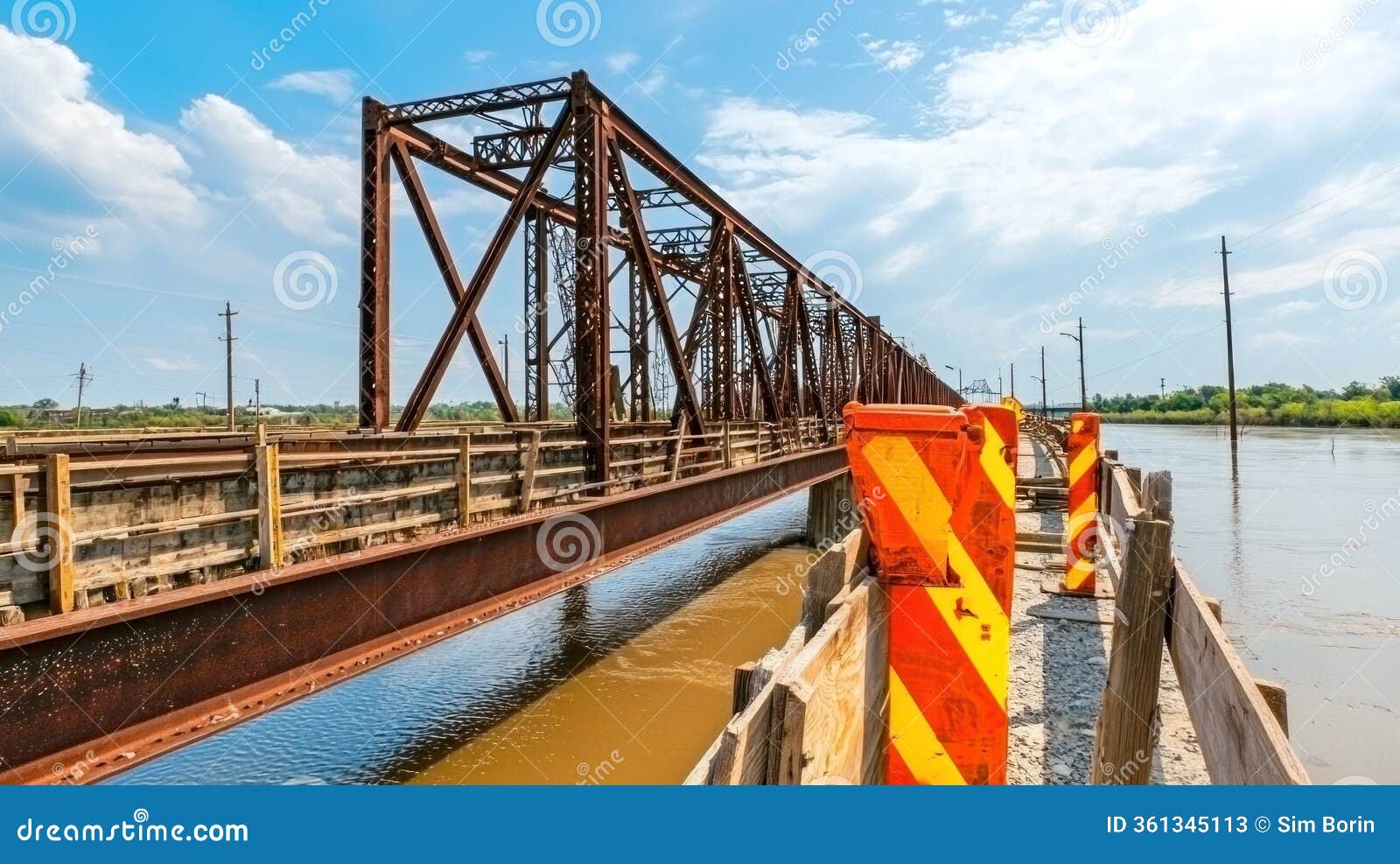 Bridge Framework Extending Over Water with Construction Equipment Stock ...