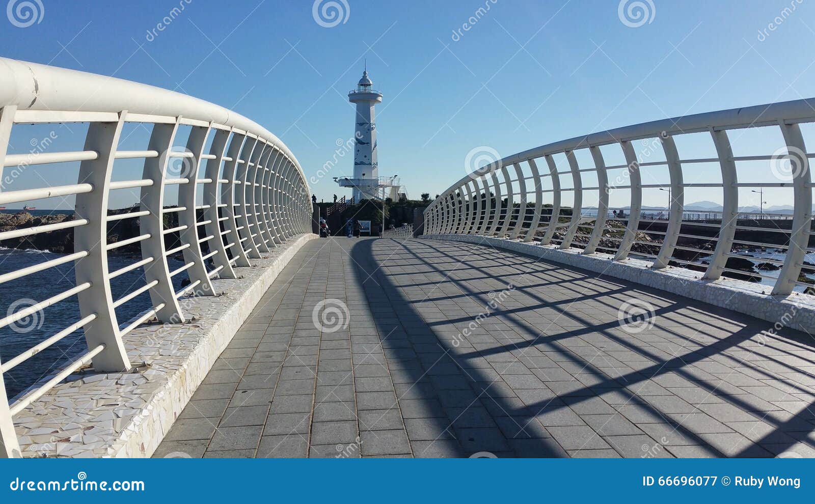Bridge Leading Up To Lighthouse Stock Image - Image of shadow, bridge ...