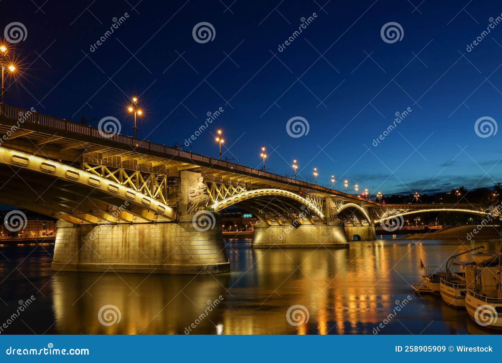 Bridge in lights at night stock image. Image of water - 258905909