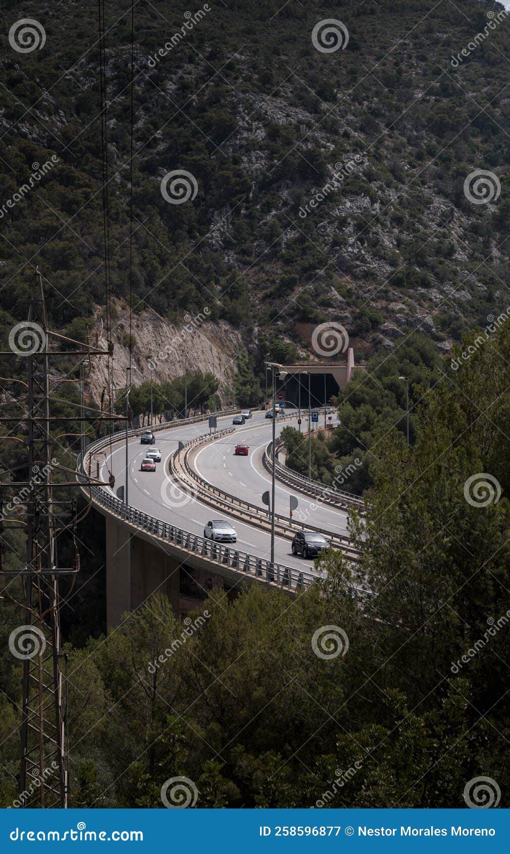 Bridge Over a Highway on a Background of Mountains. Normal Traffic ...
