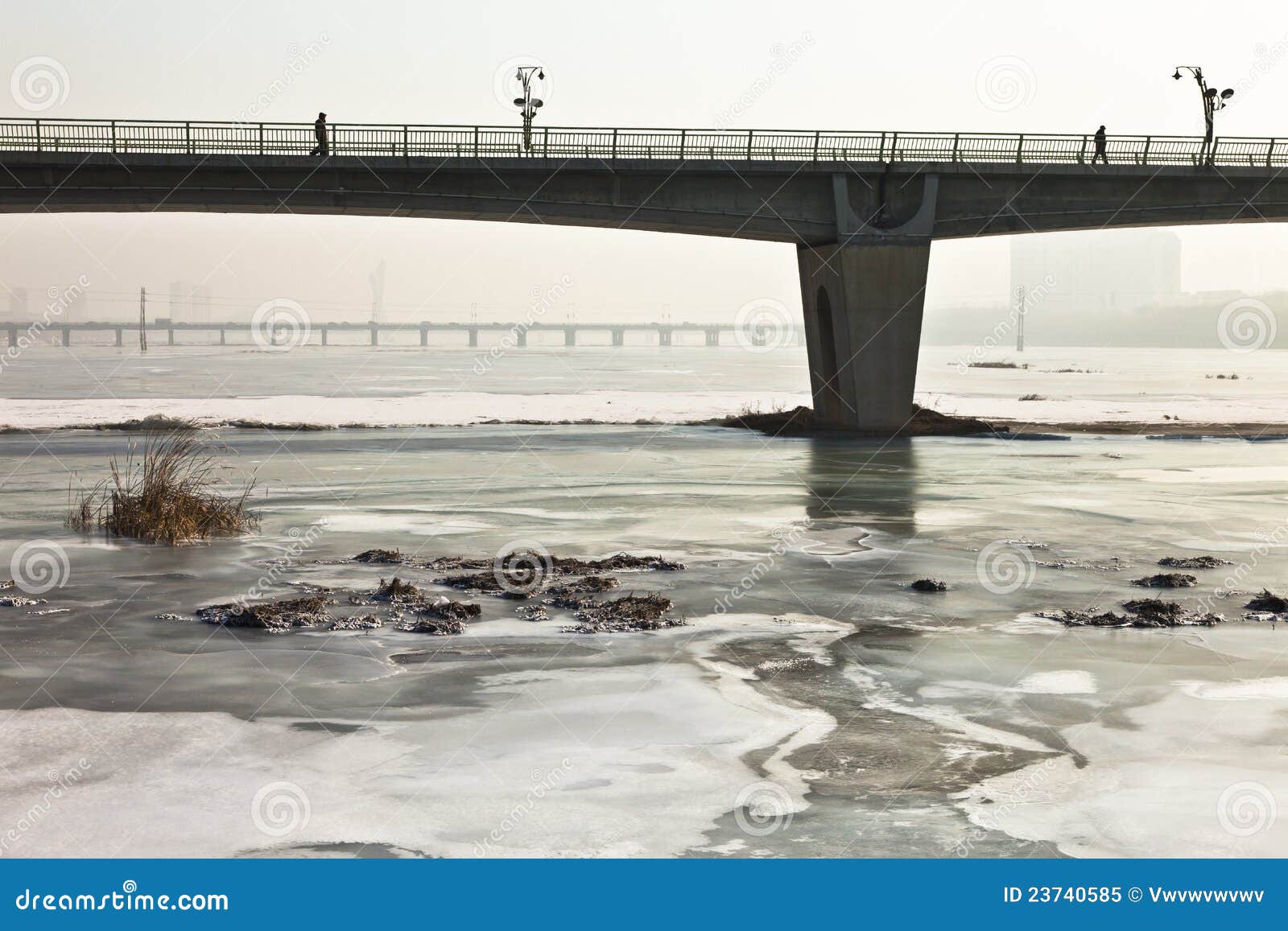A Bridge Over an Ice-covered River Stock Image - Image of white, weeds ...