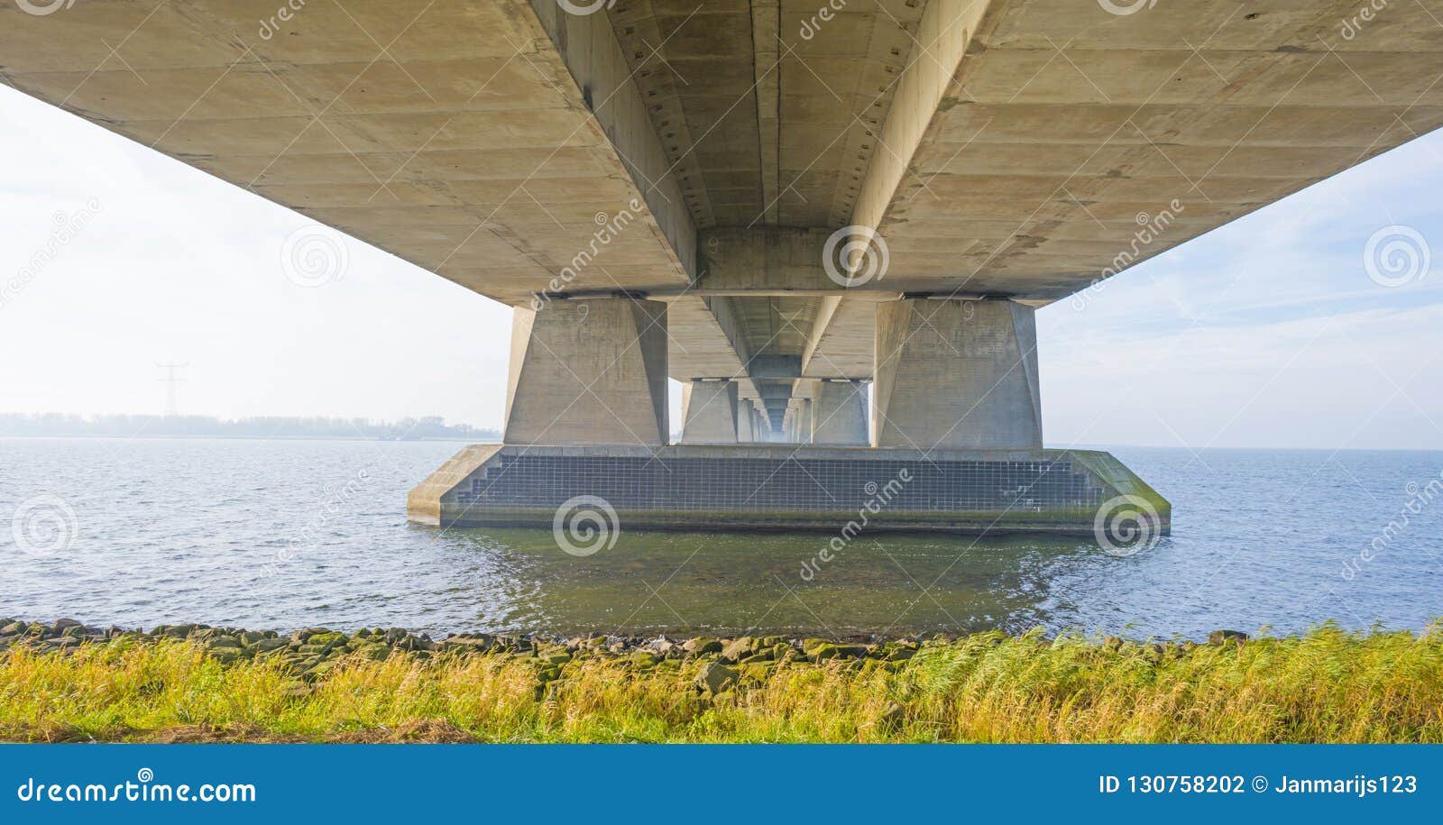 Bridge Over a Lake in Sunlight at Fall Stock Photo - Image of almere ...