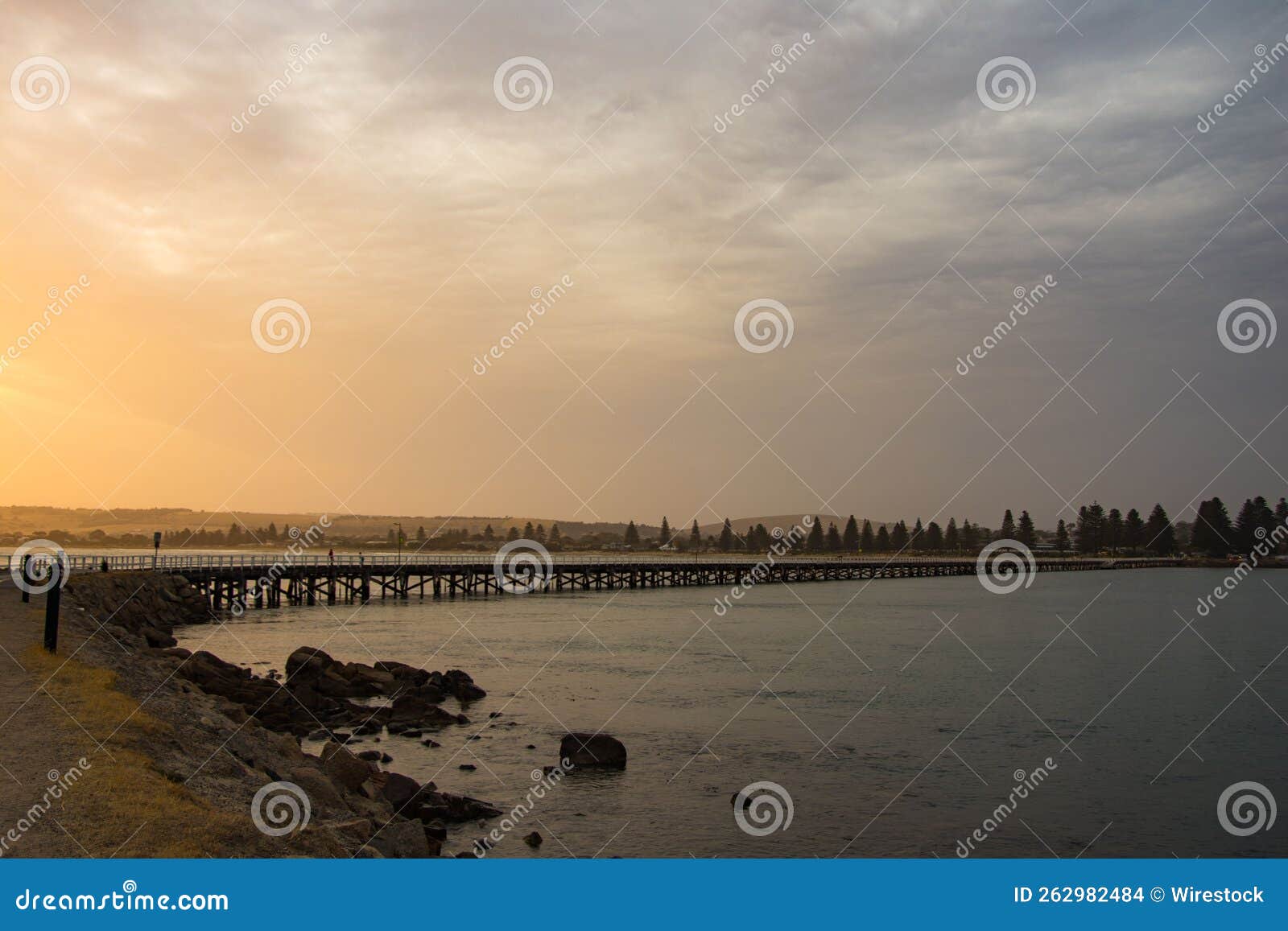 Bridge Over a Lake at Sunset with a Beautiful Cloudy Sky in the ...