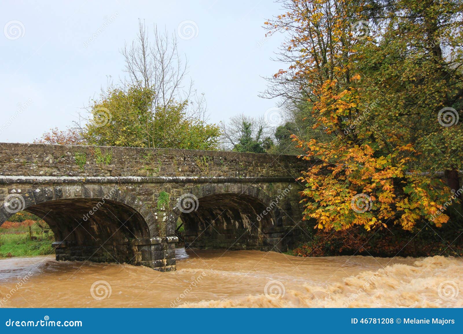 Bridge Over Muddy Stream stock photo. Image of architecture - 46781208