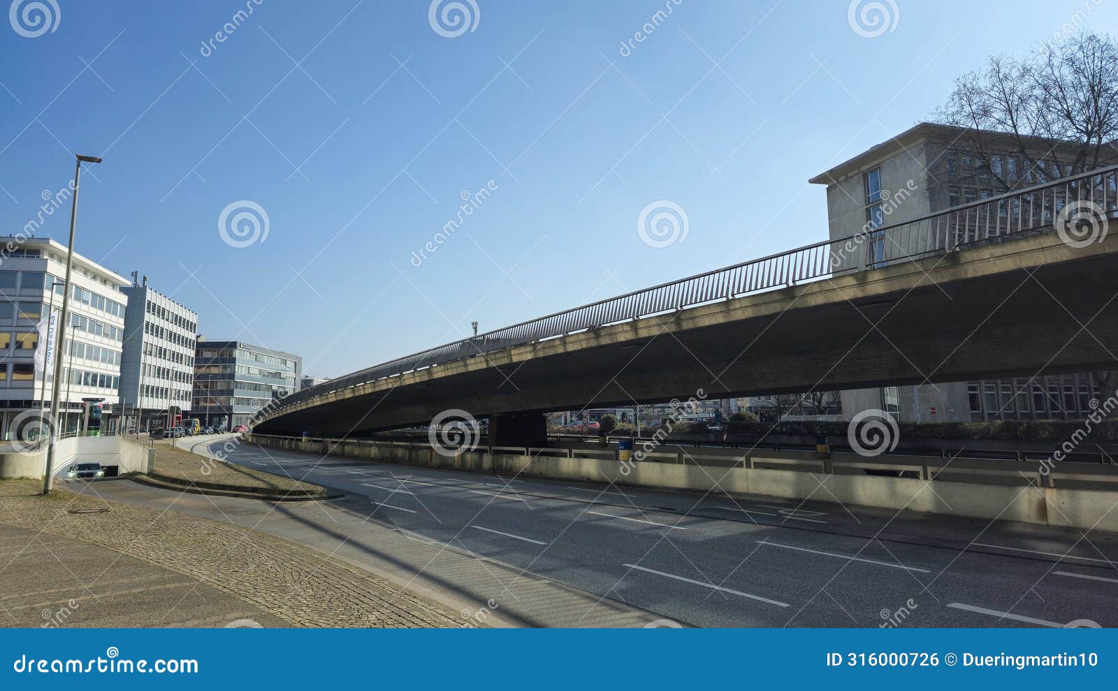 A Bridge Over a Road with a Building Facade in the Background Hanover ...