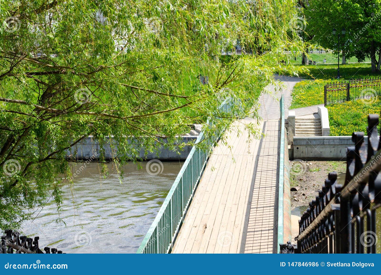 Bridge Over a Small Waterfall Stock Photo - Image of reflection, green ...
