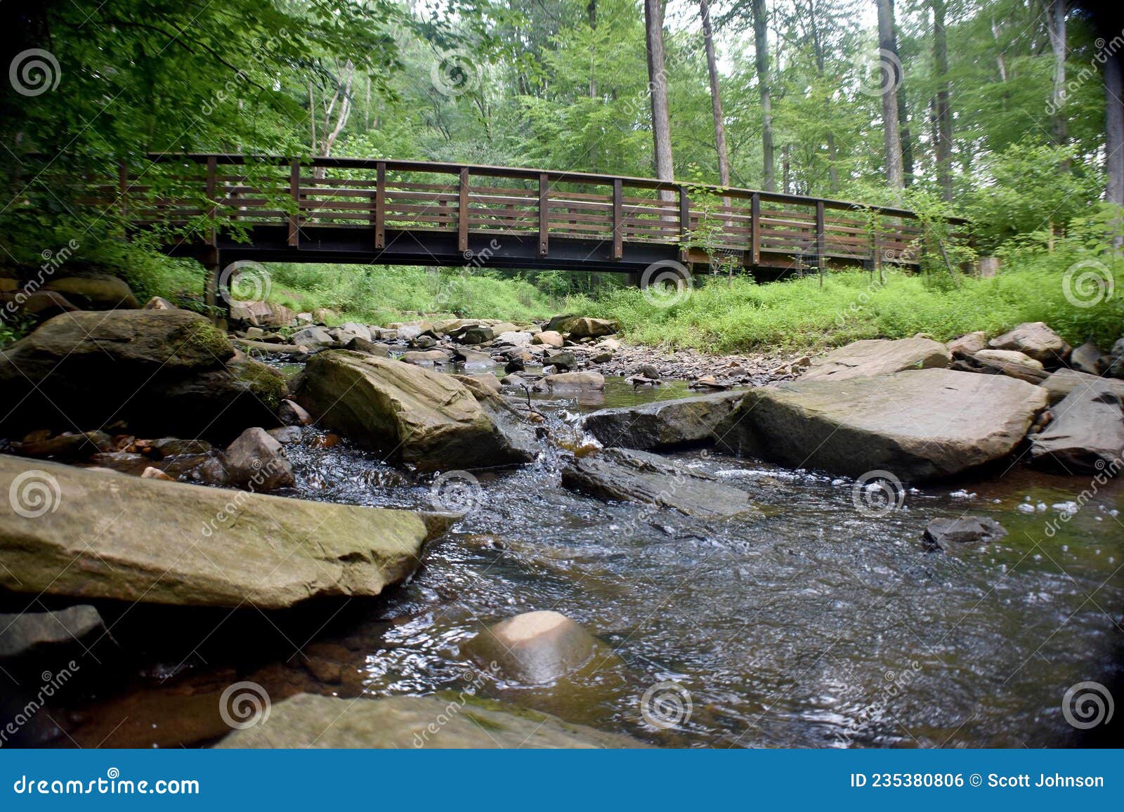 A bridge over a stream stock photo. Image of jetty, blue - 235380806