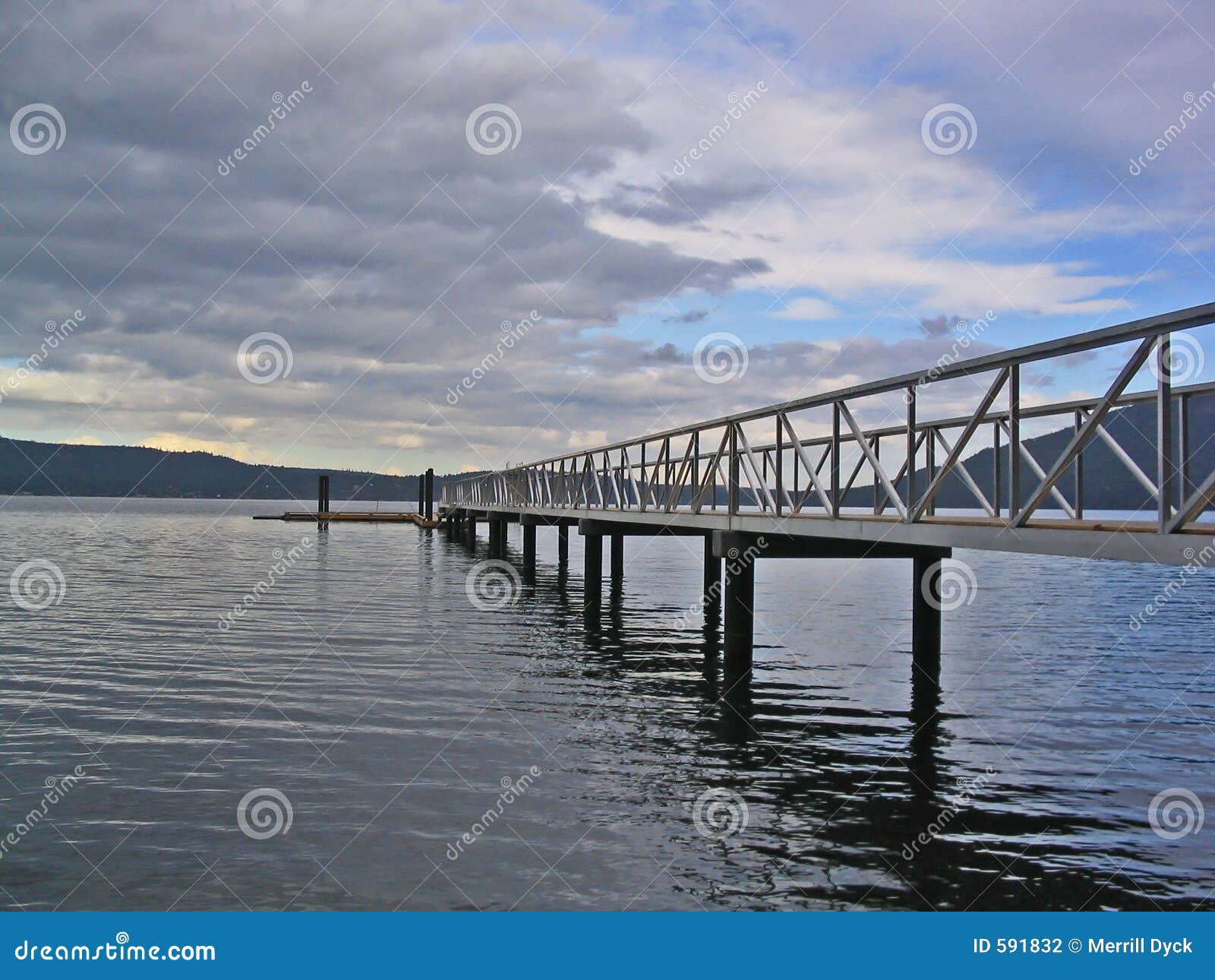 Bridge over water stock photo. Image of clouds, water, walkway - 591832