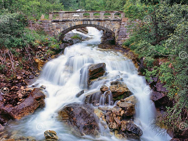 Bridge over waterfalls stock photo. Image of outdoors - 3772014