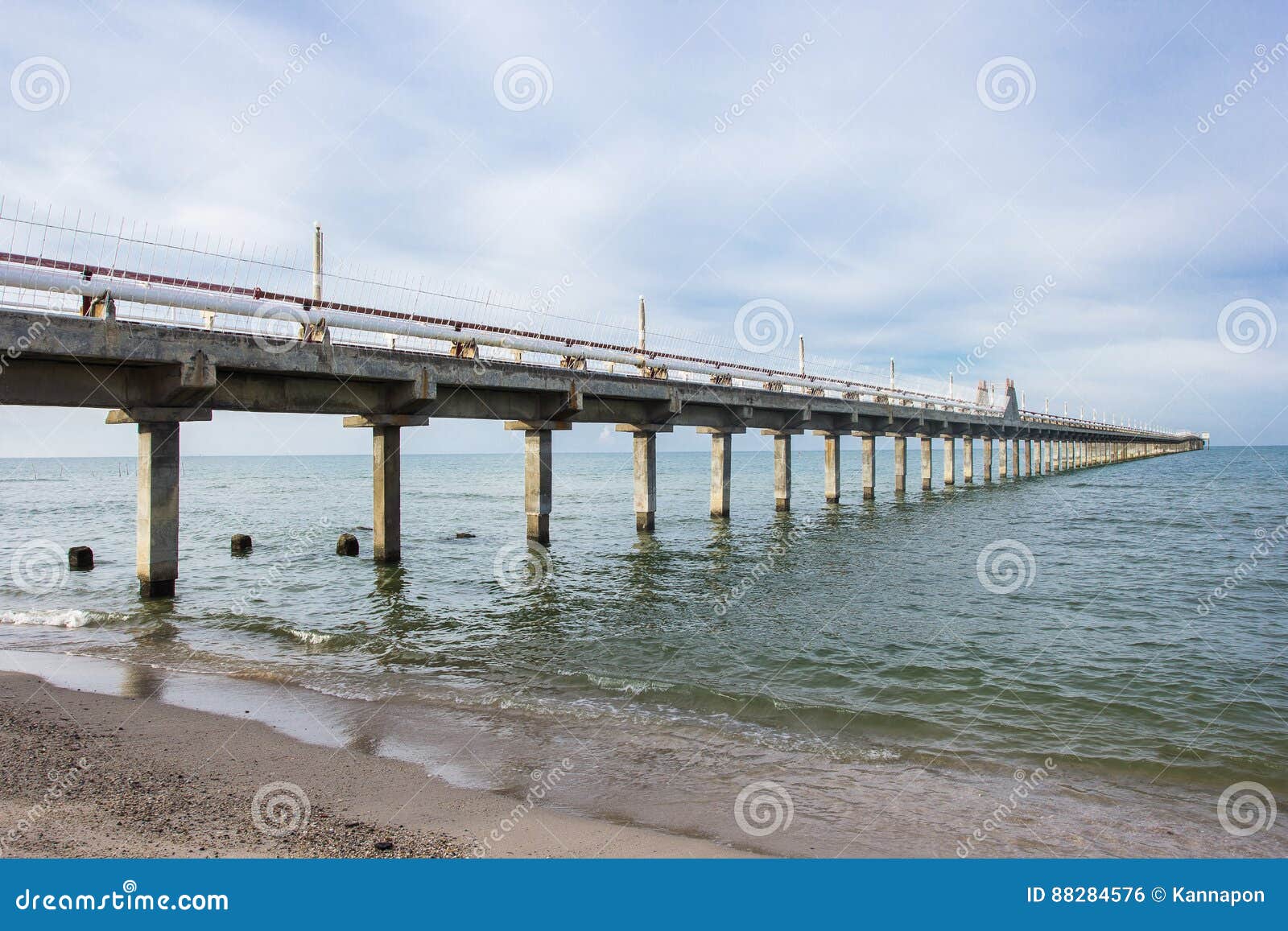 Bridge Pier Extending into the Sea Stock Photo - Image of sunlight ...