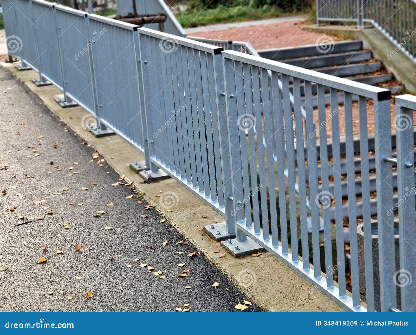 Bridge Railing with Vertical Fence Posts Anchored into the Ground Stock ...