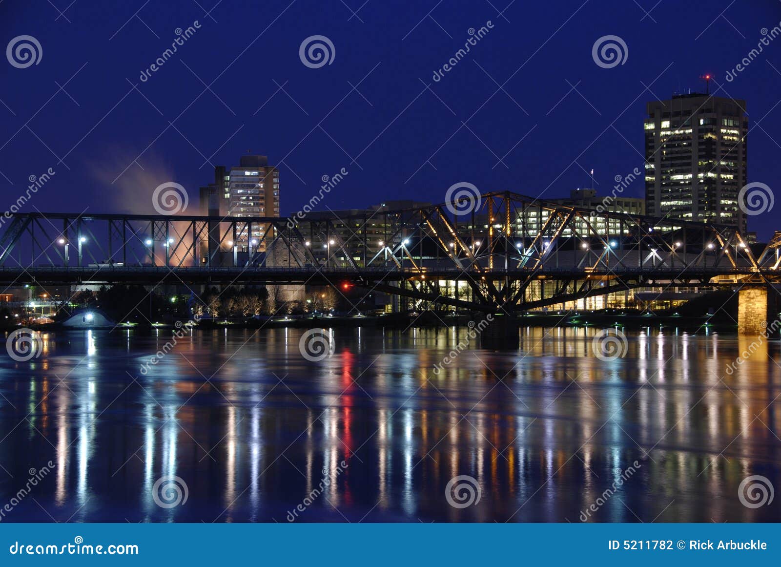 Bridge Reflecting on a Calm River Stock Photo - Image of reflection ...