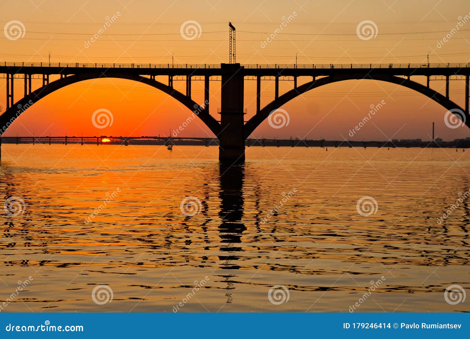 A Bridge on a River Lit by the Sun at Sunset. Evening River Landscape ...