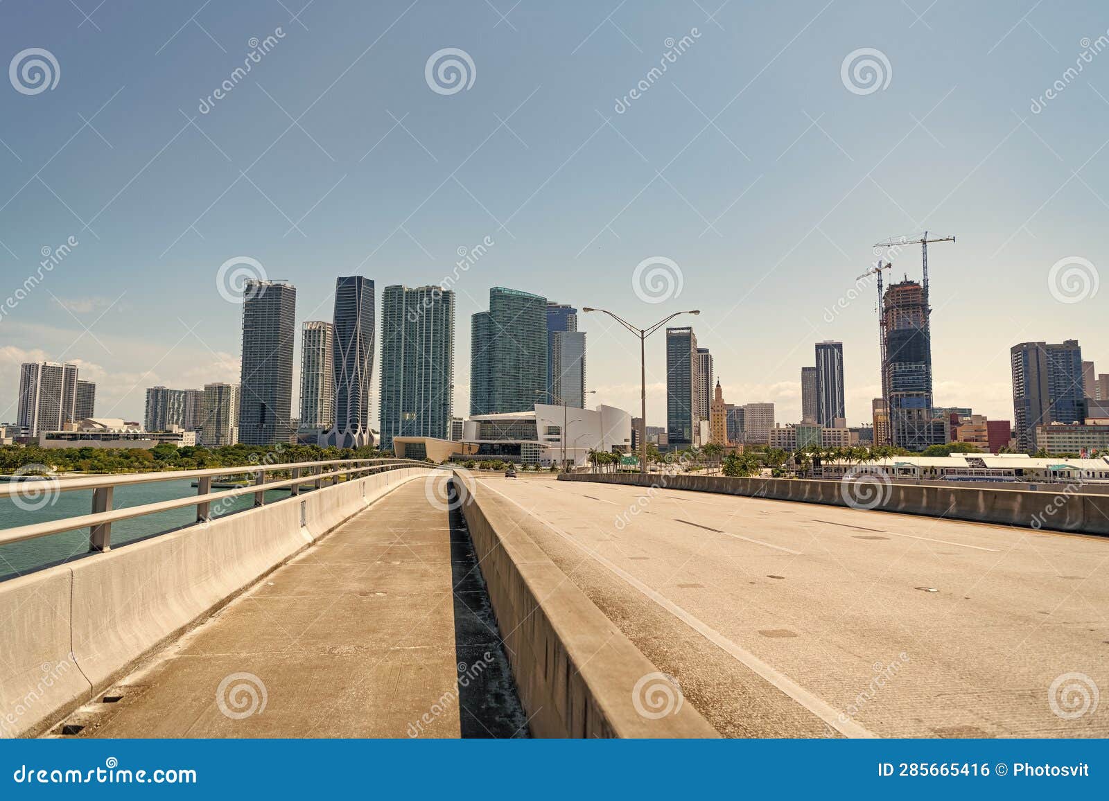 Bridge Road Over River on Urban Skyline Stock Photo - Image of roadway ...