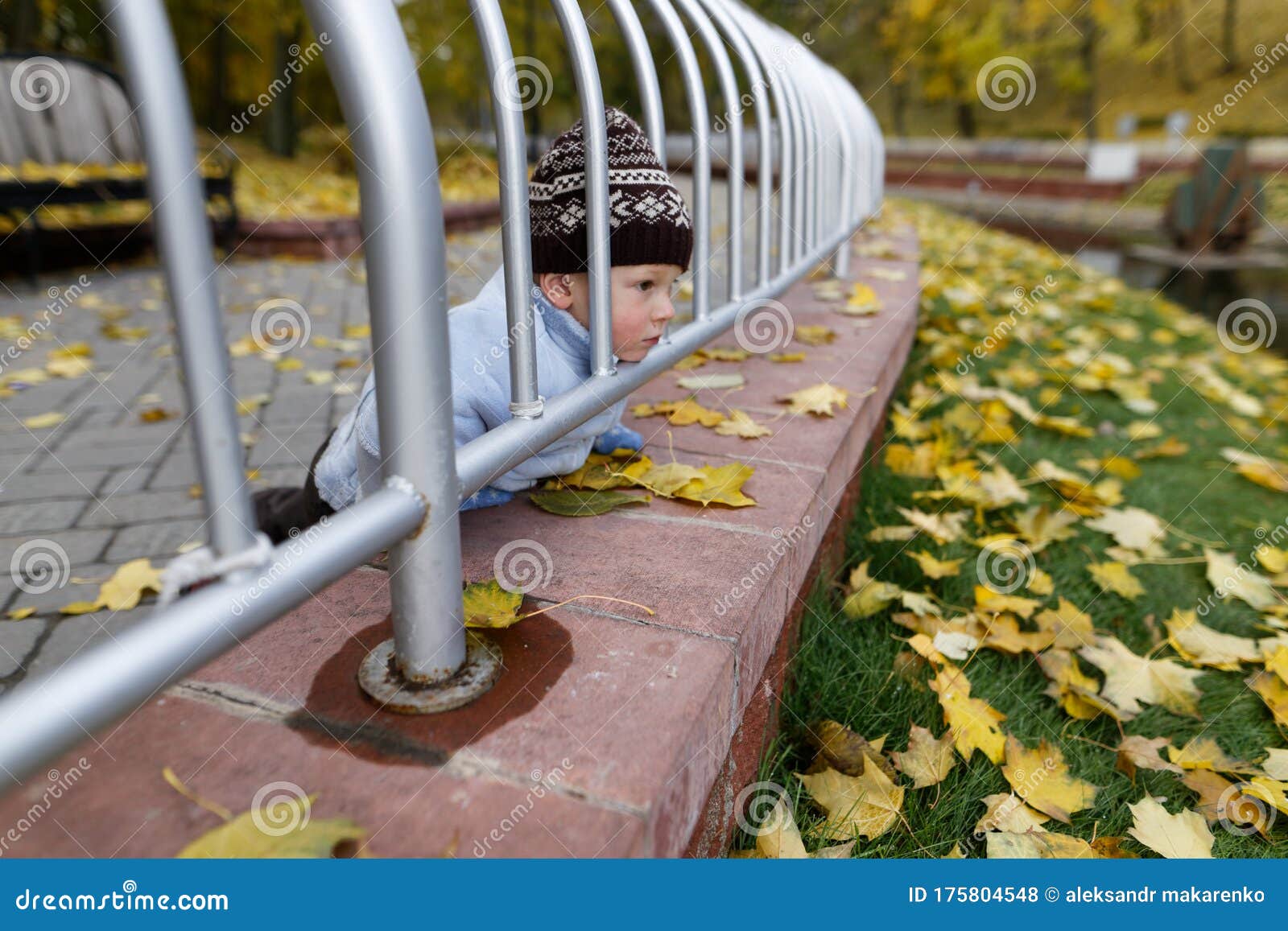 On the Bridge a Small Child Looks Down from the Bridge Stock Photo ...