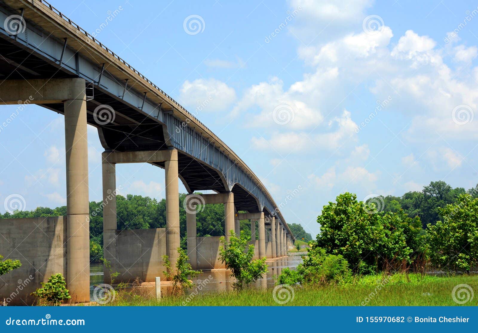 Curving Bridge Spans Arkansas River Stock Photo - Image of clouds ...