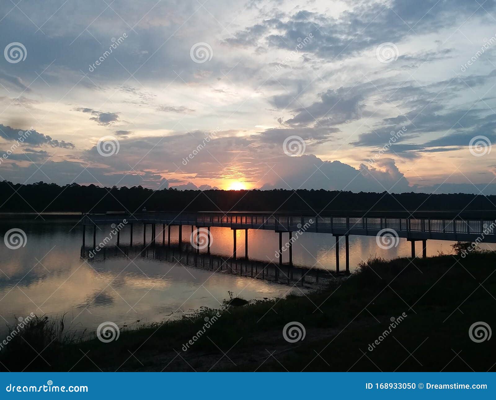 Lake stock photo. Image of clouds, sunset, lake, bridge - 168933050