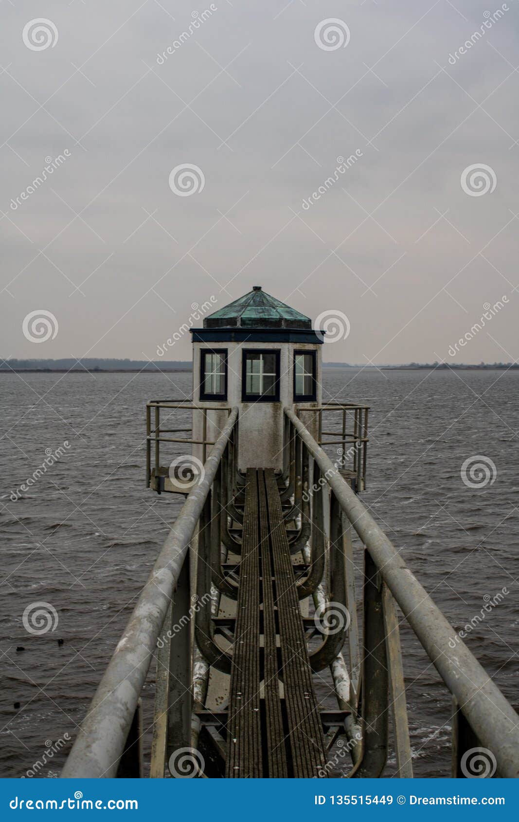 Bridge to the lighthouse stock image. Image of dutch - 135515449