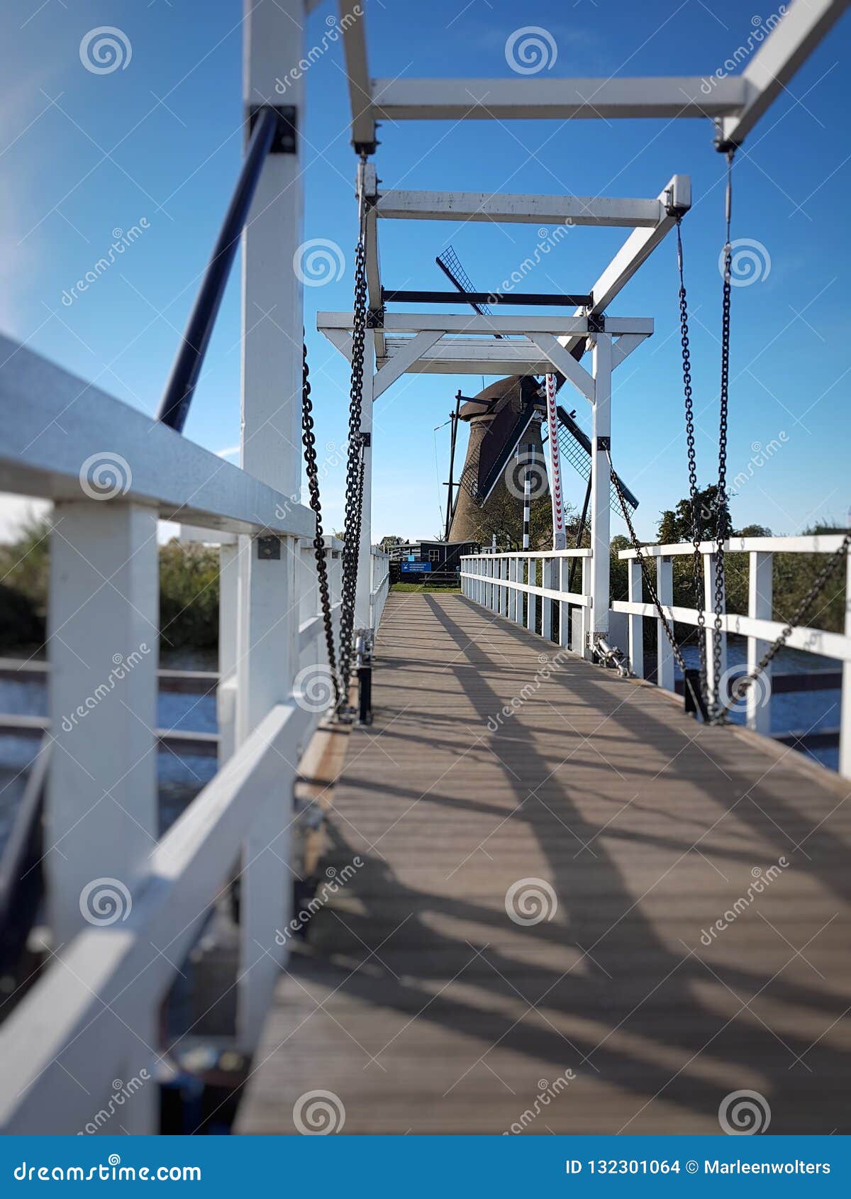 The bridge to a windmill stock photo. Image of world - 132301064