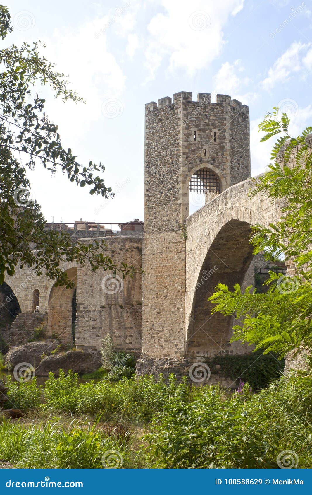 Bridge and a Tower Made of Stone Over a River Stock Image - Image of ...