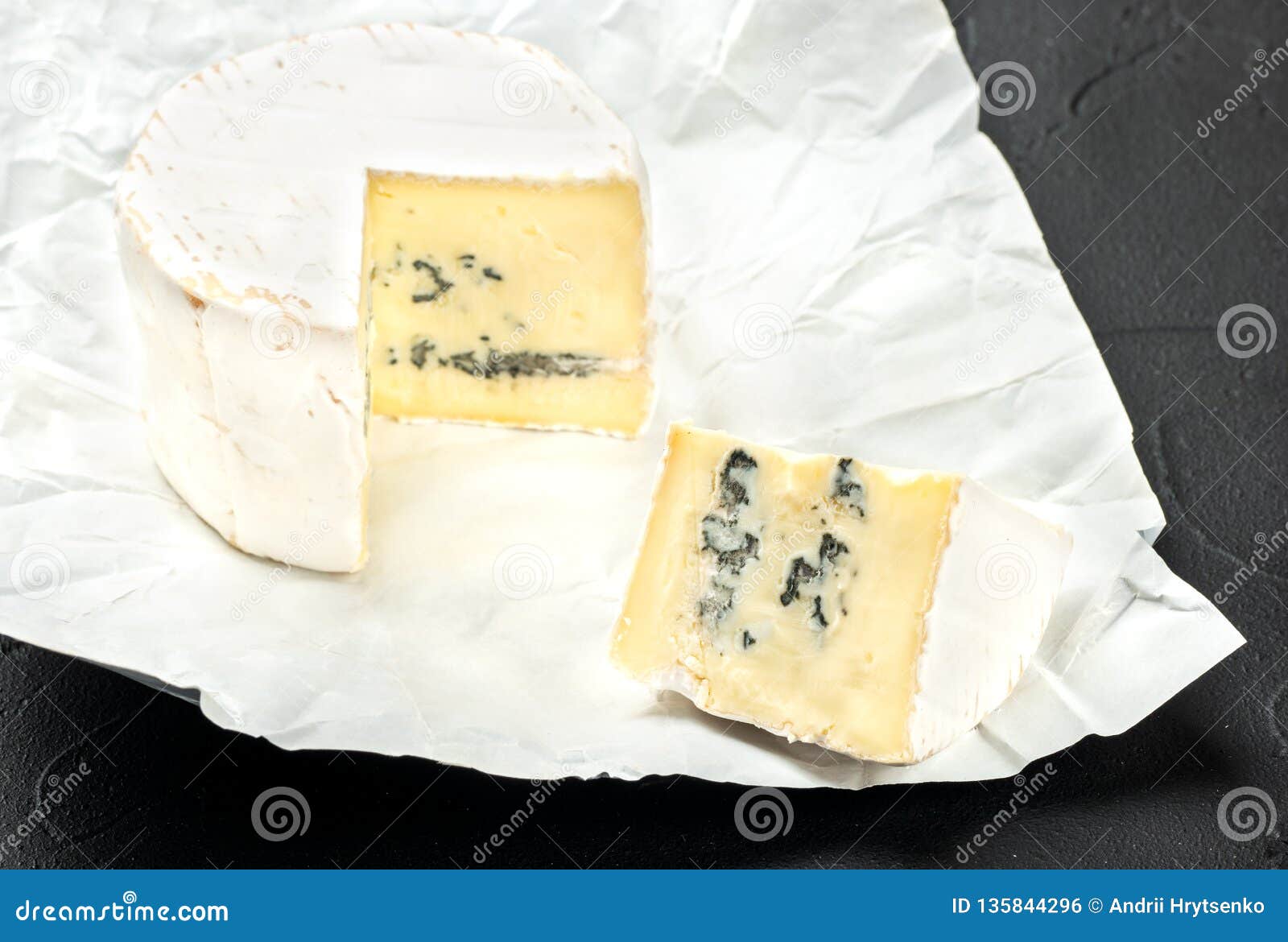 Brie cheese with slice stock photo. Image of berries - 135844296