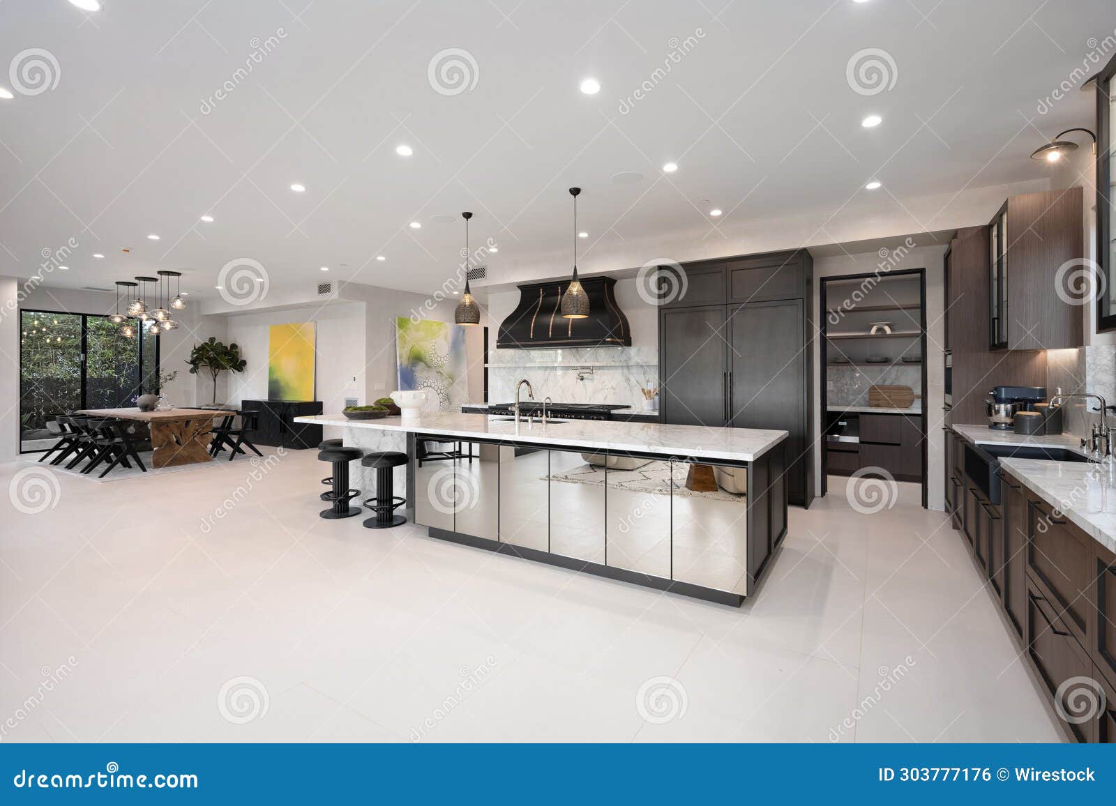 Bright and Airy Kitchen is Illuminated by Multiple Overhead Lights ...