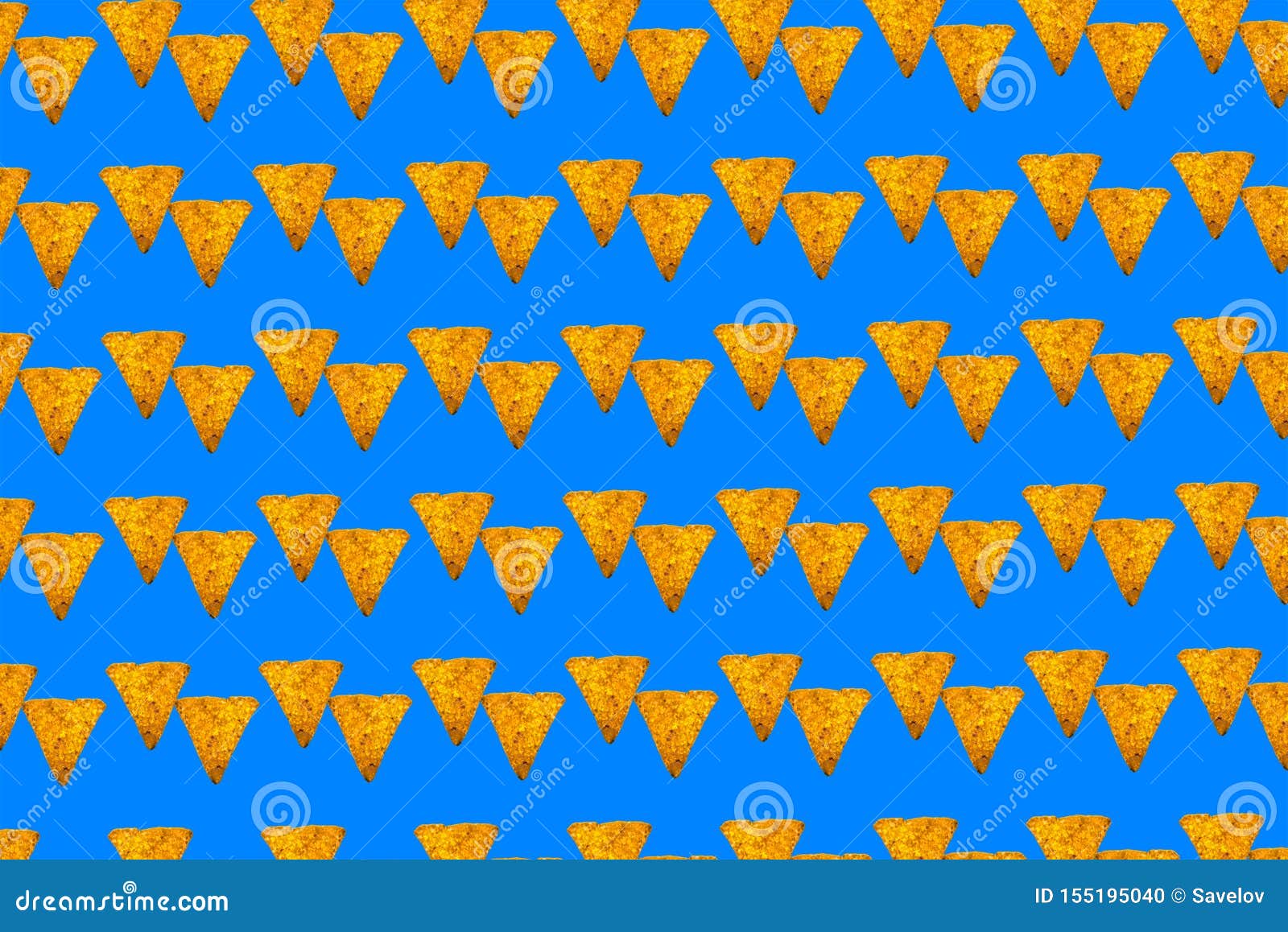 Bright Background of Triangular Nachos Slices on Blue Color Stock Photo ...