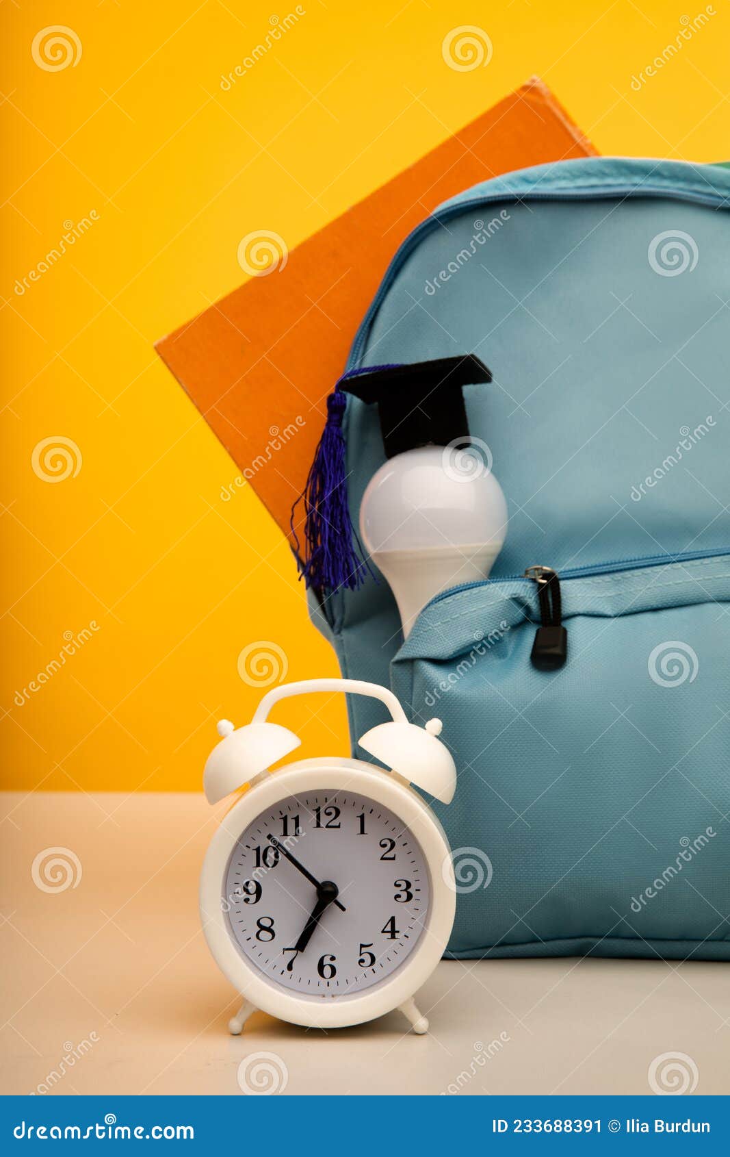 Bright Backpack, Alarm Clock and Bulb. Education Concept Stock Image ...