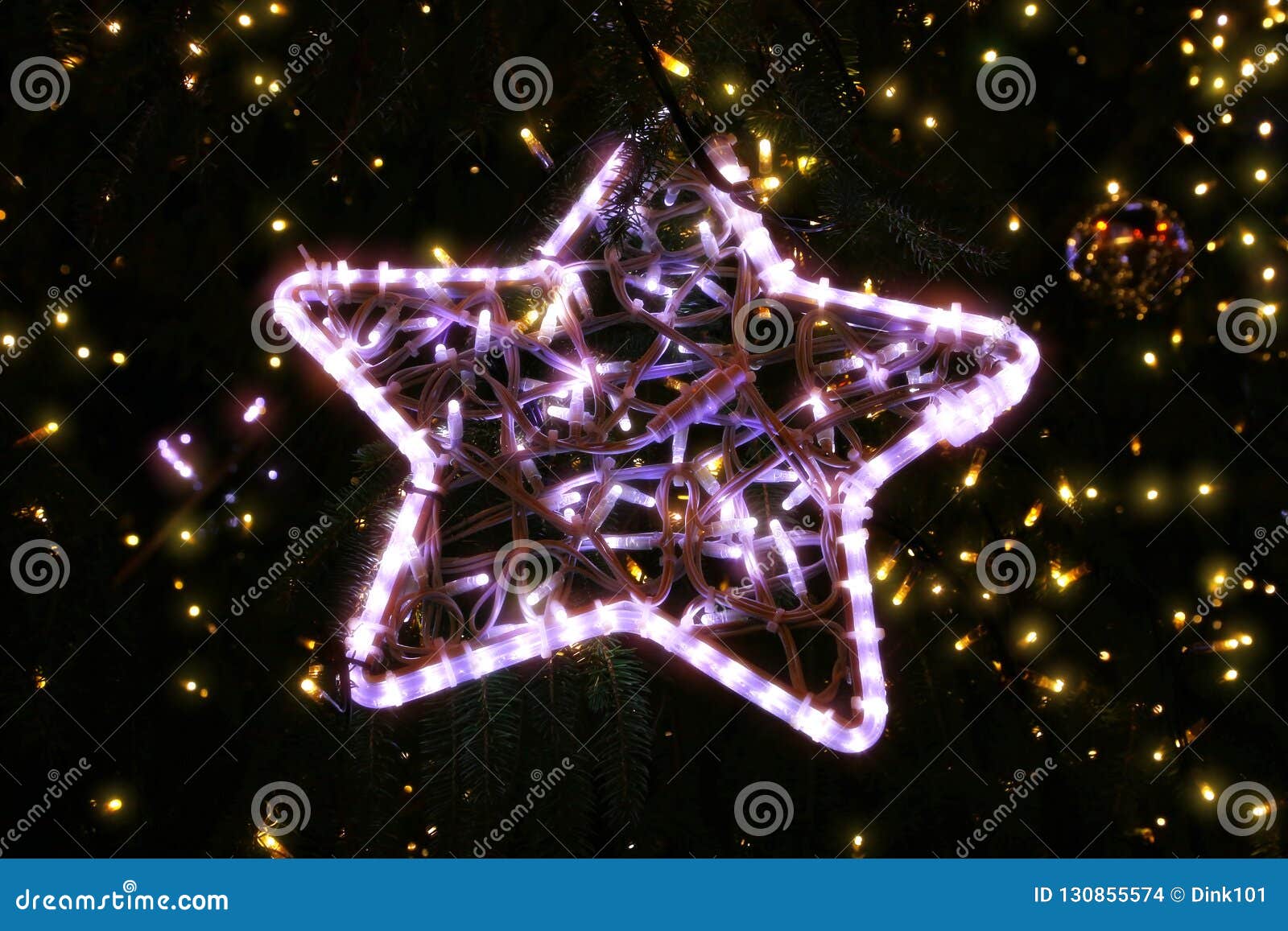 Bright Beautiful Glowing Star on a Christmas Tree in the Evening Stock ...