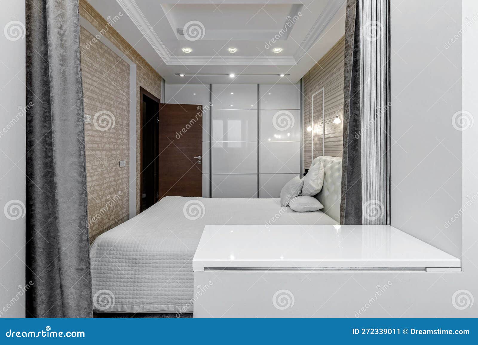 Bright Bedroom with Large White Bed and Capitone Headboard Stock Image ...