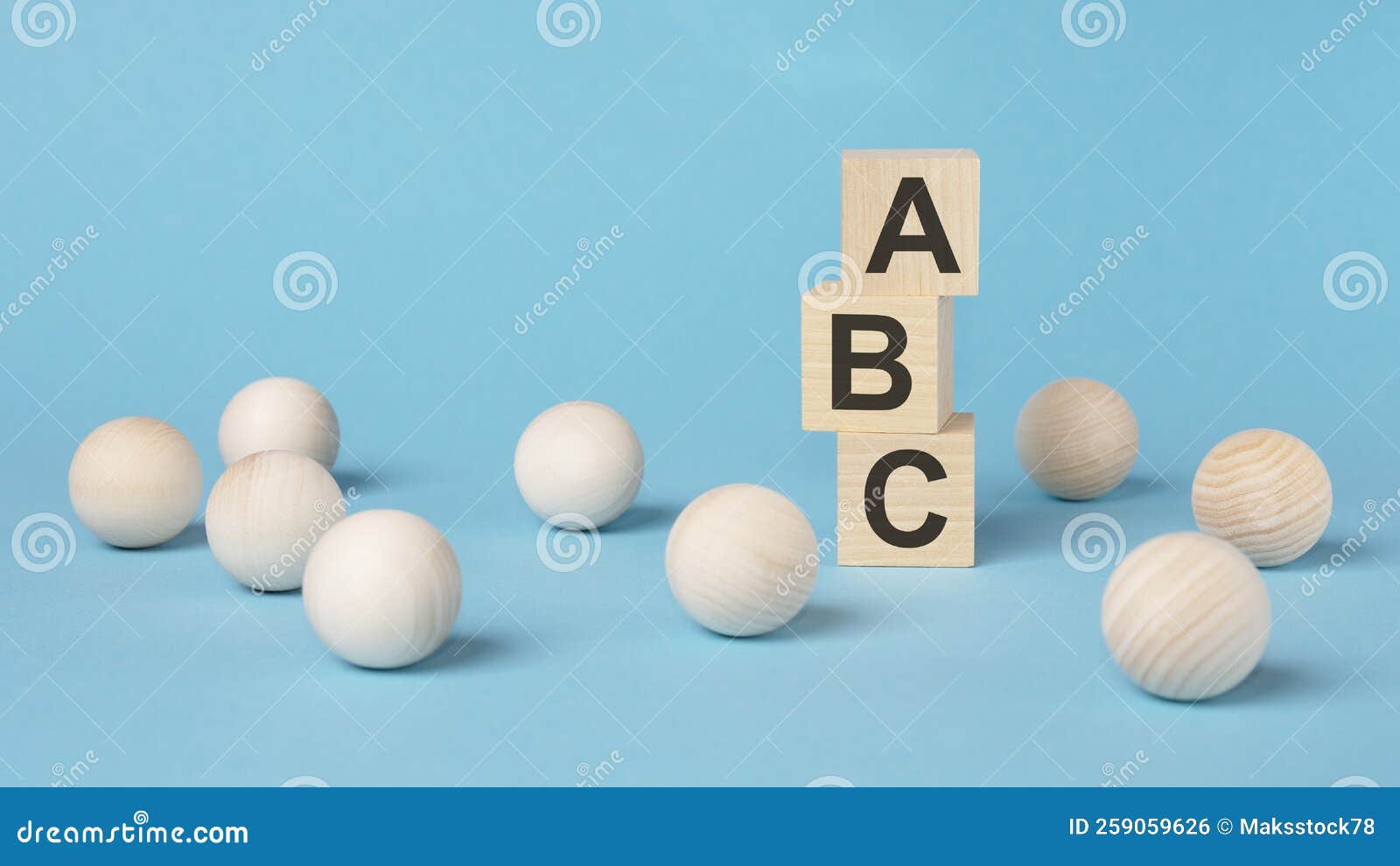 On a Bright Blue Background, Light Wooden Blocks and Cubes with the ...