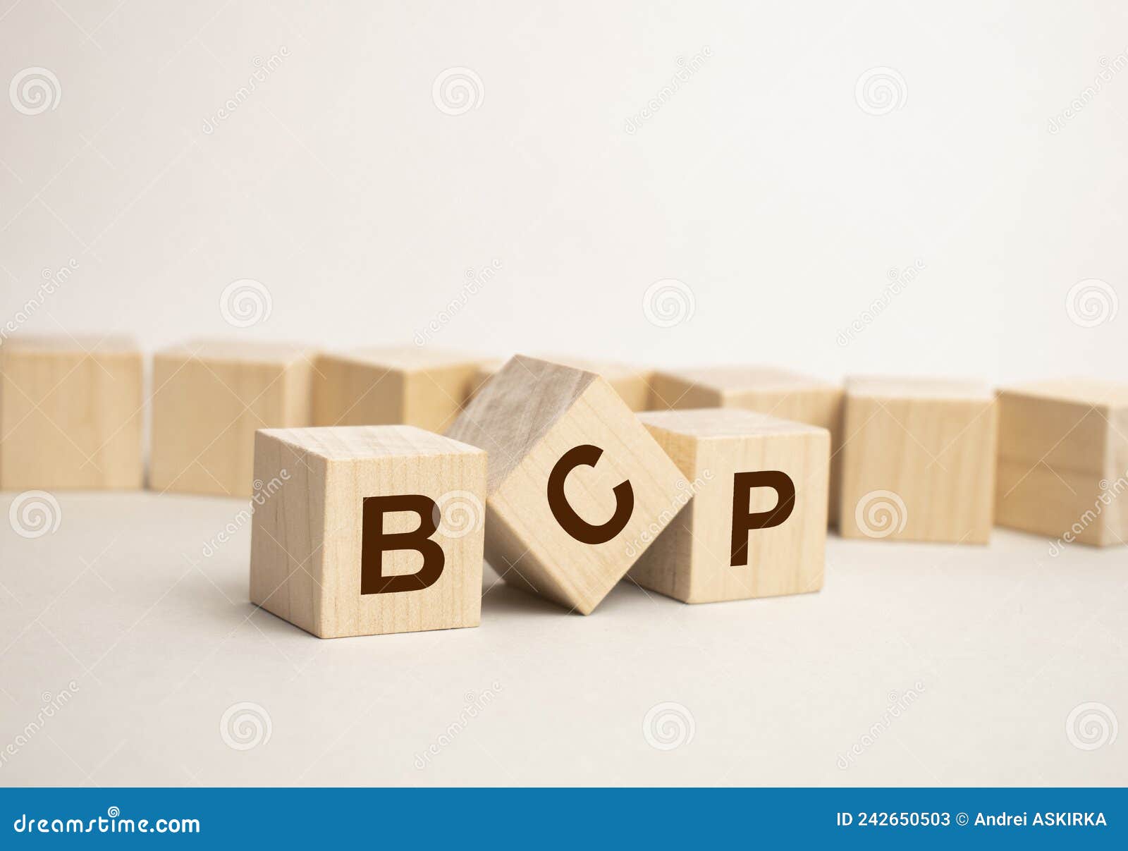 On a Bright Blue Background, Light Wooden Blocks and Cubes with the ...